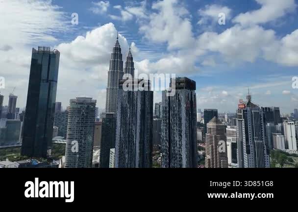 time lapse shot of a large, dense metropolitan city dominated by a mix ...