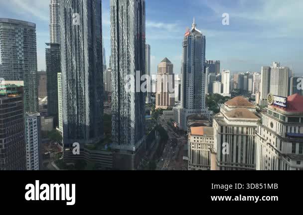 time lapse shot of a large, dense metropolitan city dominated by a mix ...