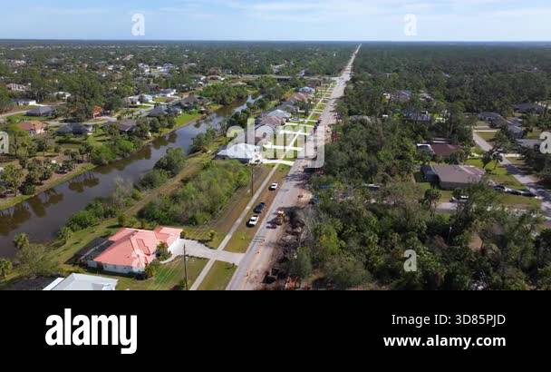 Florida residential road under construction with excavators, cones, and ...