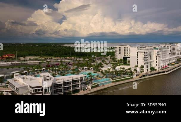Hurricane storm clouds above waterfront resort complex. Vacation ...