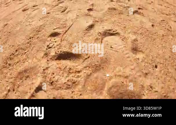 Close-up view of sandy terrain, showcasing the gradual texture changes ...