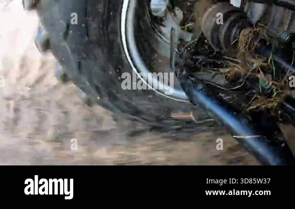 Close-up view of a rotating tire on a vehicle, showcasing the dynamic ...