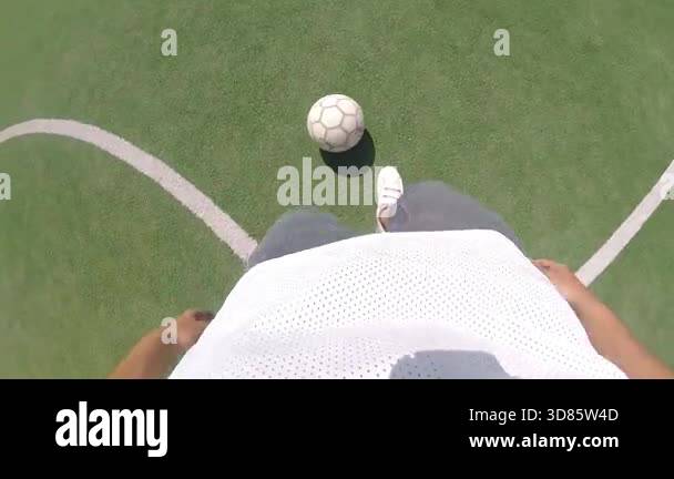 Football player demonstrates impressive ball control and agility on ...