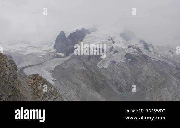 Glaciers and rugged mountains along the SwissItalian border, showcasing ...