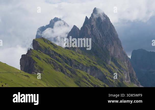 Seceda Ridge with Fog over Green Alpine Slopes in the Dolomites in ...