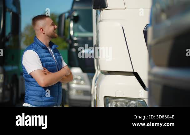 Happy professional male trucker showing his love for his job by ...