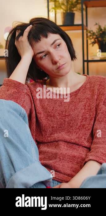 Sad lonely Caucasian girl looks pensive thinks over life concerns ...
