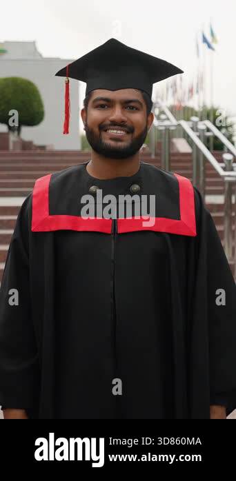 Happy indian student wearing a traditional graduation cap and gown ...