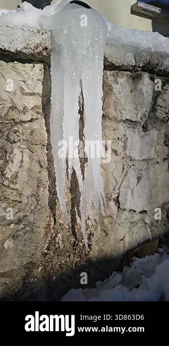 Slow-motion video of a giant melting ice stalactite Stock Video Footage ...