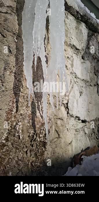 Slow-motion video of a giant melting ice stalactite Stock Video Footage ...
