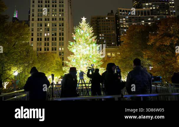 Photographers capturing the annual Christmas tree lighting ceremony in ...