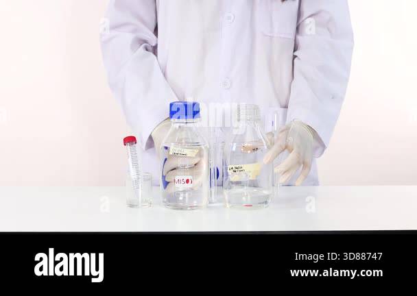 Observing color change in a chemical reaction Stock Video Footage - Alamy