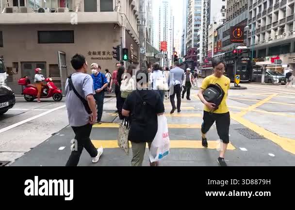 People walking and crossing at a city intersection Stock Video Footage ...