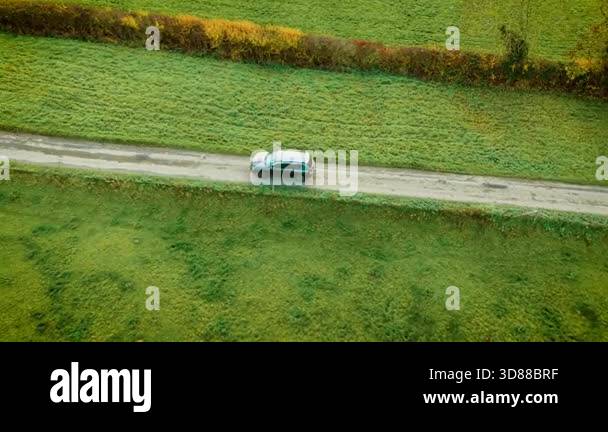 Car driving along countryside road heading forward. SUV moving through ...