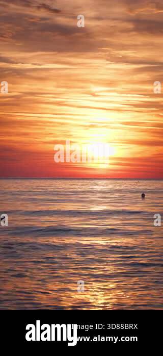 Scenic sunrise over the sea horizon and tropical island beach, the sun ...