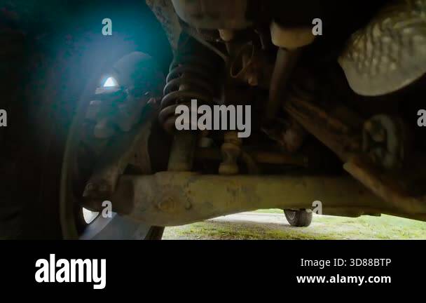 Car suspension working with spring compressing during inspection ...
