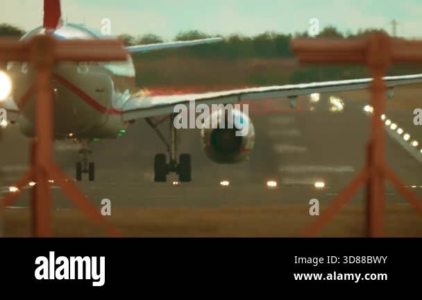 Passenger jet accelerating on runway with engines producing heat haze ...