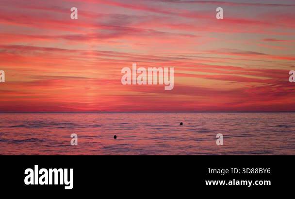 Scenic sunrise over the sea horizon and tropical island beach, the sun ...