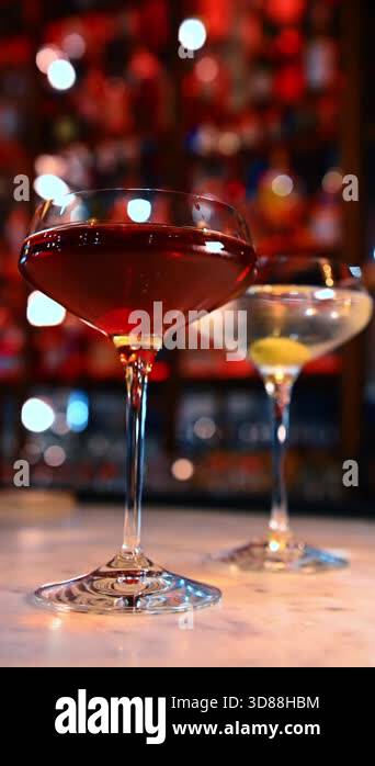 Two cocktails on marble. Two elegant cocktails rest on a marble counter ...