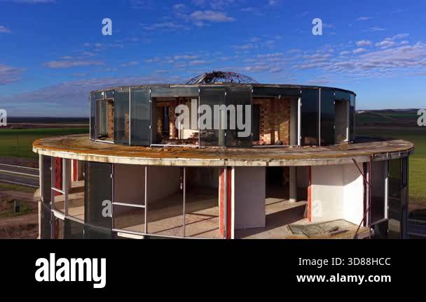 Footage around the top of the building of cylinder shape. Some sun ...