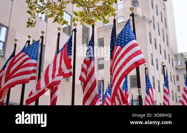 Poles with American flags flapping in the wind. Patriotic symbols of ...