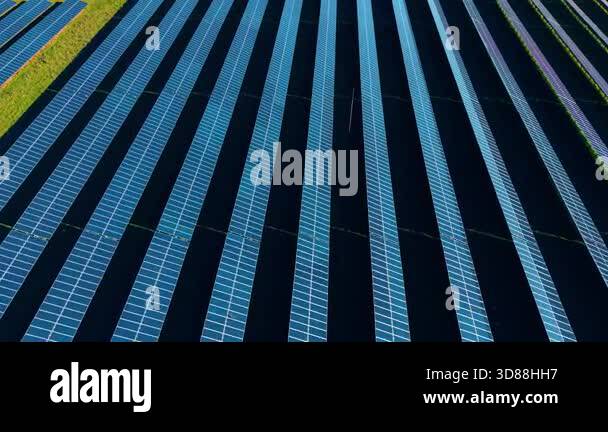 Footage over the rows of long solar panels. Sun energy transformation ...