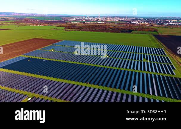 Footage from drone over the vast fields with solar panels. Oil refinery ...