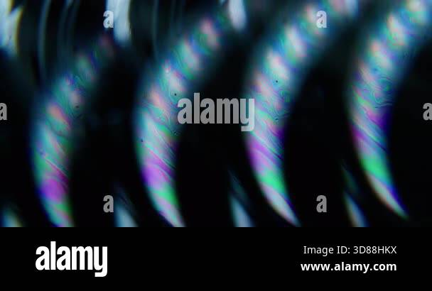 Defocused color fluid. Paint water. Purple blue green chemical neon ...