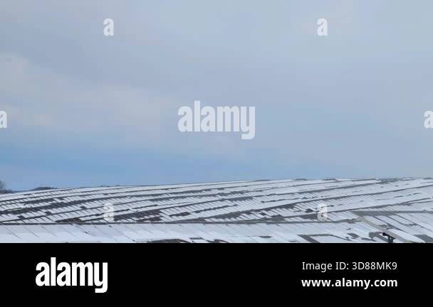Lack of solar energy in winter. Solar panels covered in snow in a field ...