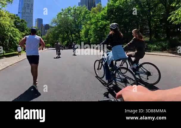 New York, USA, 8 November 2025: Cycling along Central Park roadway ...