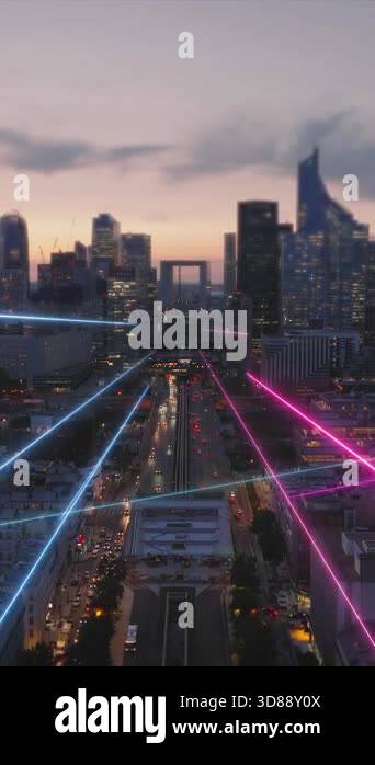 Forwards fly above town development at dusk. Skyline with modern high ...