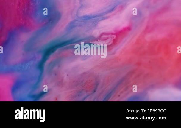 Spilling multicolor emulsion. Flowing paint. Blur blue red orange ...