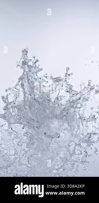 Super Slow Motion Shot of Real Water Splash on Light Background at ...