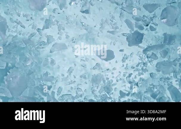 Super Slow Motion Shot of Real Ice Pieces Exploding Towards Camera on ...