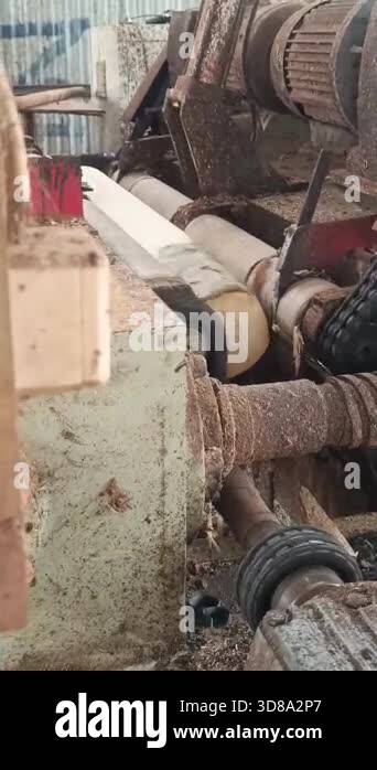 A close view reveals an automated wood shaping process, displaying the ...