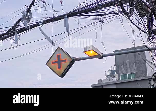 Traffic signage and messy, tangled communication wires creating visual ...