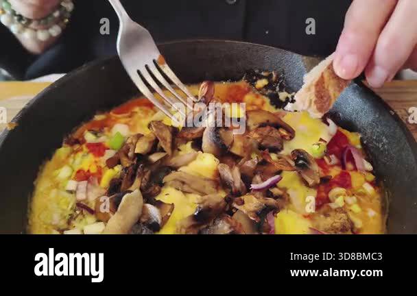 High angle closeup video of a woman serving himself with a spoon a ...