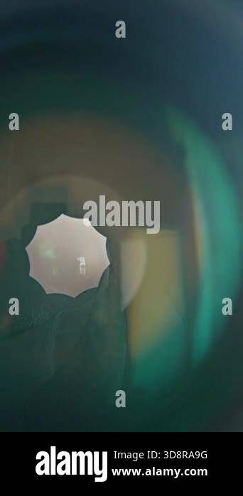 vintage camera lens aperture tunnel with teal and amber reflections ...