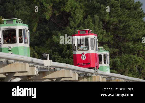 BUSAN, SOUTH KOREA - OCTOBER 10, 2025 - Tourists riding colorful Sky ...