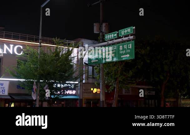 SEOUL, SOUTH KOREA - OCTOBER 11, 2025 - Green street signs in Hongdae ...