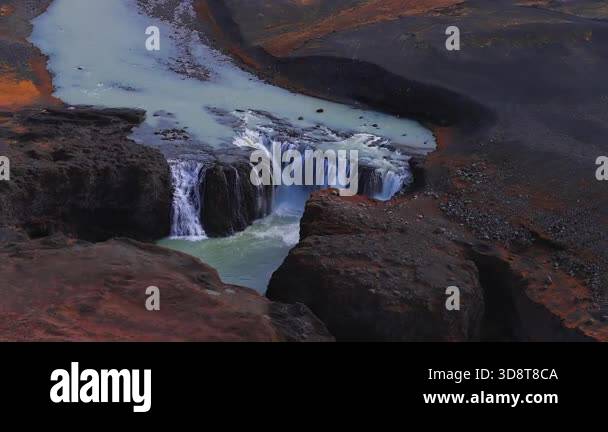 Aerial camera glides over Sigoldugljufur in Iceland, showing tiered ...