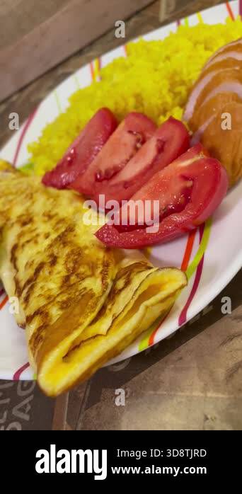 healthy nutritious breakfast: rice, omelet with cheese, tomatoes ...