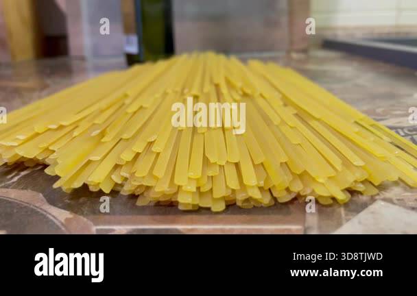 uncooked spaghetti pasta on the kitchen counter Stock Video Footage - Alamy