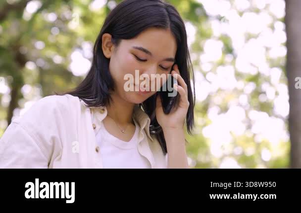 Young Japanese professional enjoying relaxed communication while ...