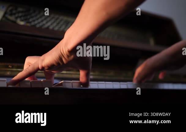 Skilled pianist performing intricate melody, capturing delicate hand ...