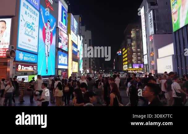 Night street level view at Dotonbori Ebisubashi in Osaka. Glico sign ...