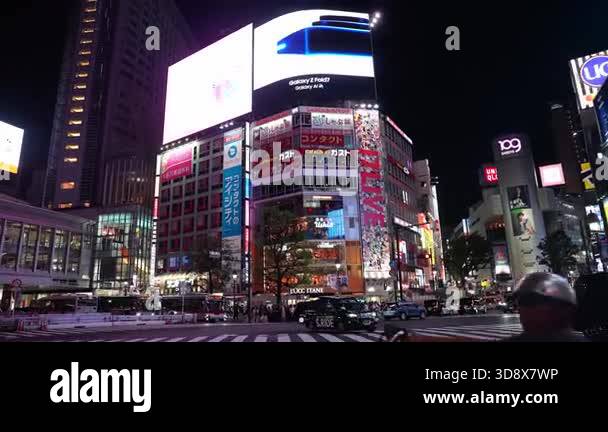 Wide angle view of Shibuya Crossing in Tokyo at night. Illuminated ...