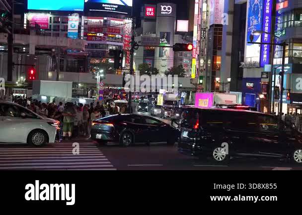 Night street level view at Shibuya Crossing in Tokyo. Shibuya 109 and ...