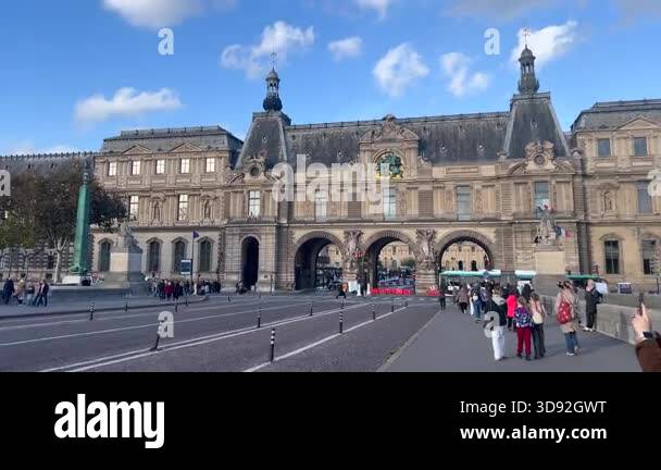 People visiting the historical louvre palace in Paris, a world-famous ...