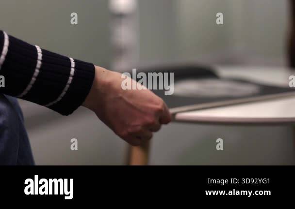 Close-up of human hands flipping through a magazine, turning pages ...